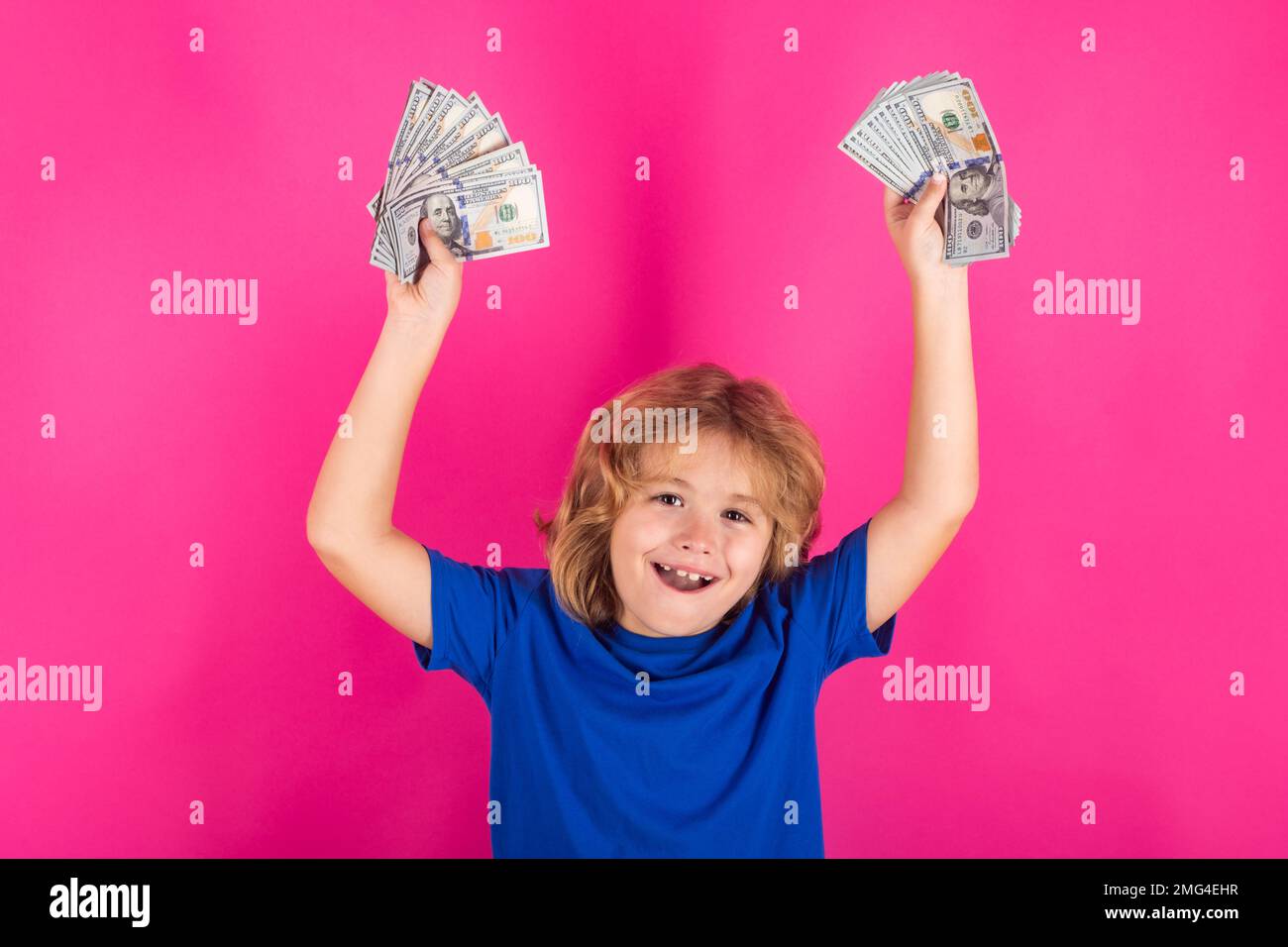 Donation saving charity and finance concept. Happy rich kid boy with ...