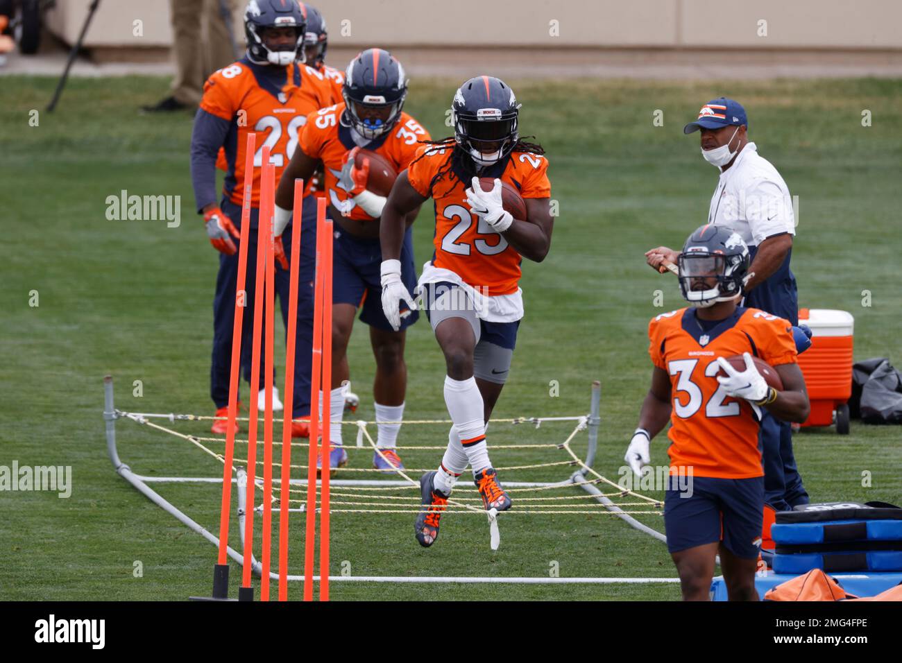 Denver Broncos running back Melvin Gordon (25) takes part in drills ...