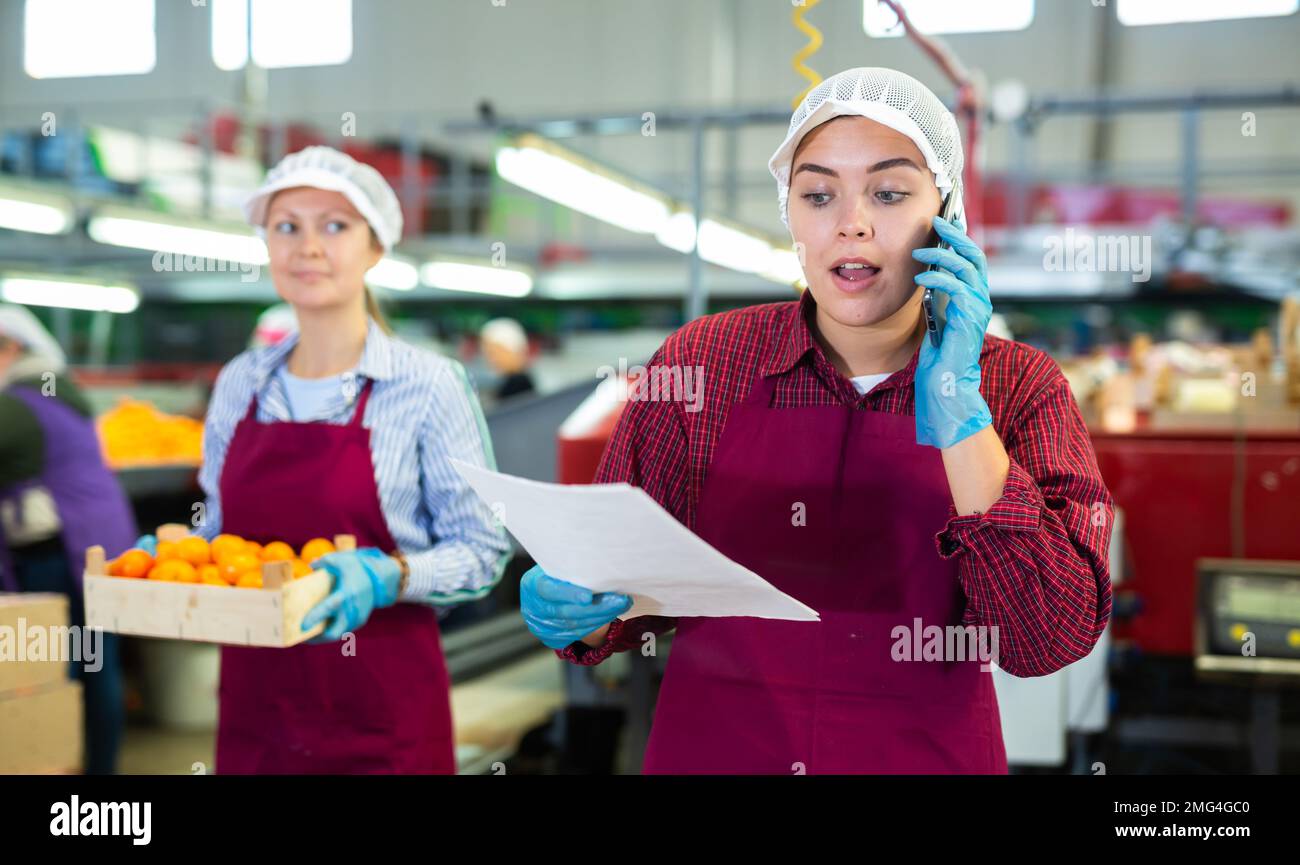 Positive cheerful woman worker conducts business negotiations on the ...