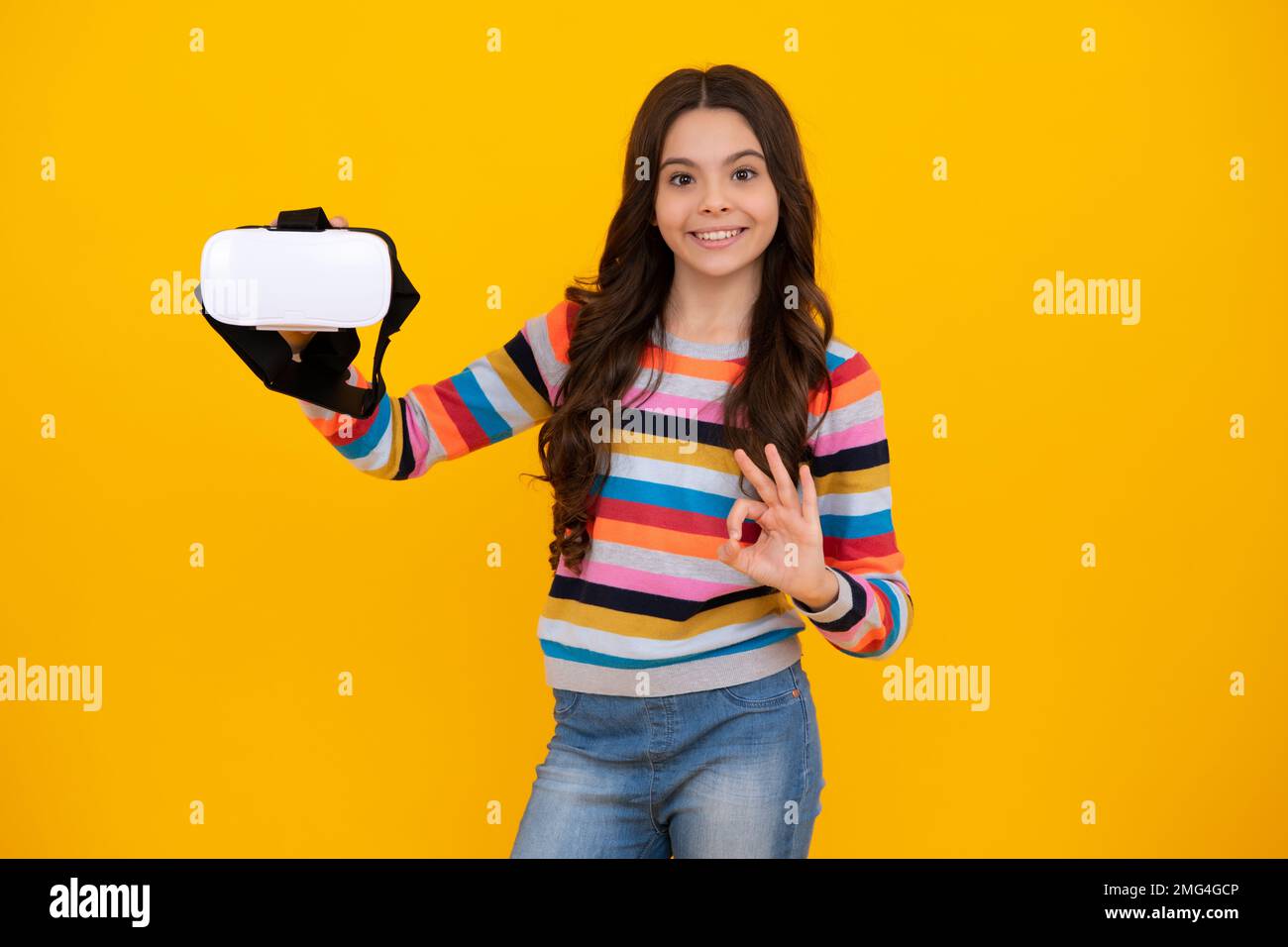 Virtual gadgets for child, free time and study. Teen school girl uses ...