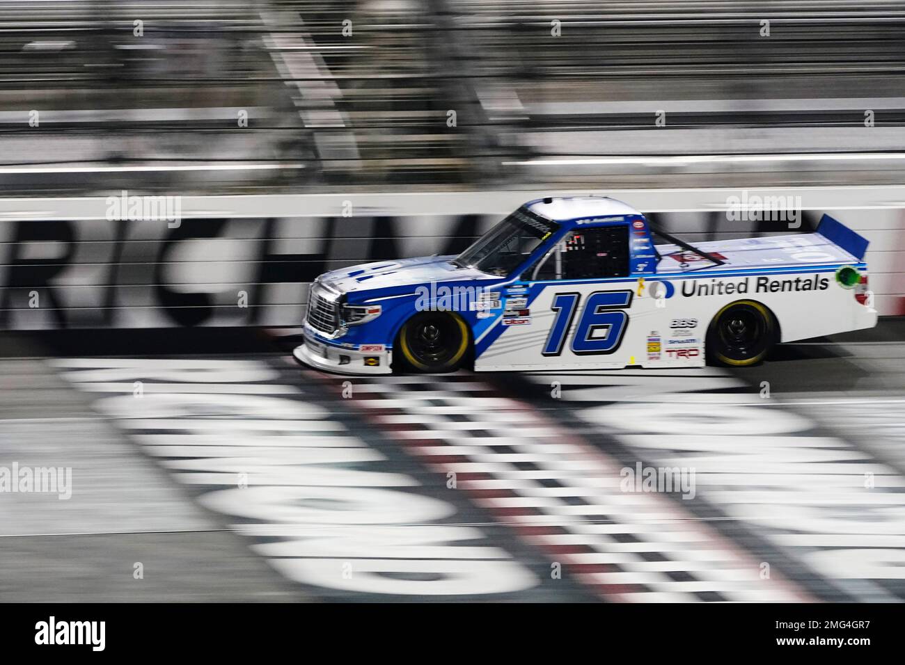 Austin Hill crosses the start-finish line during the NASCAR Truck ...