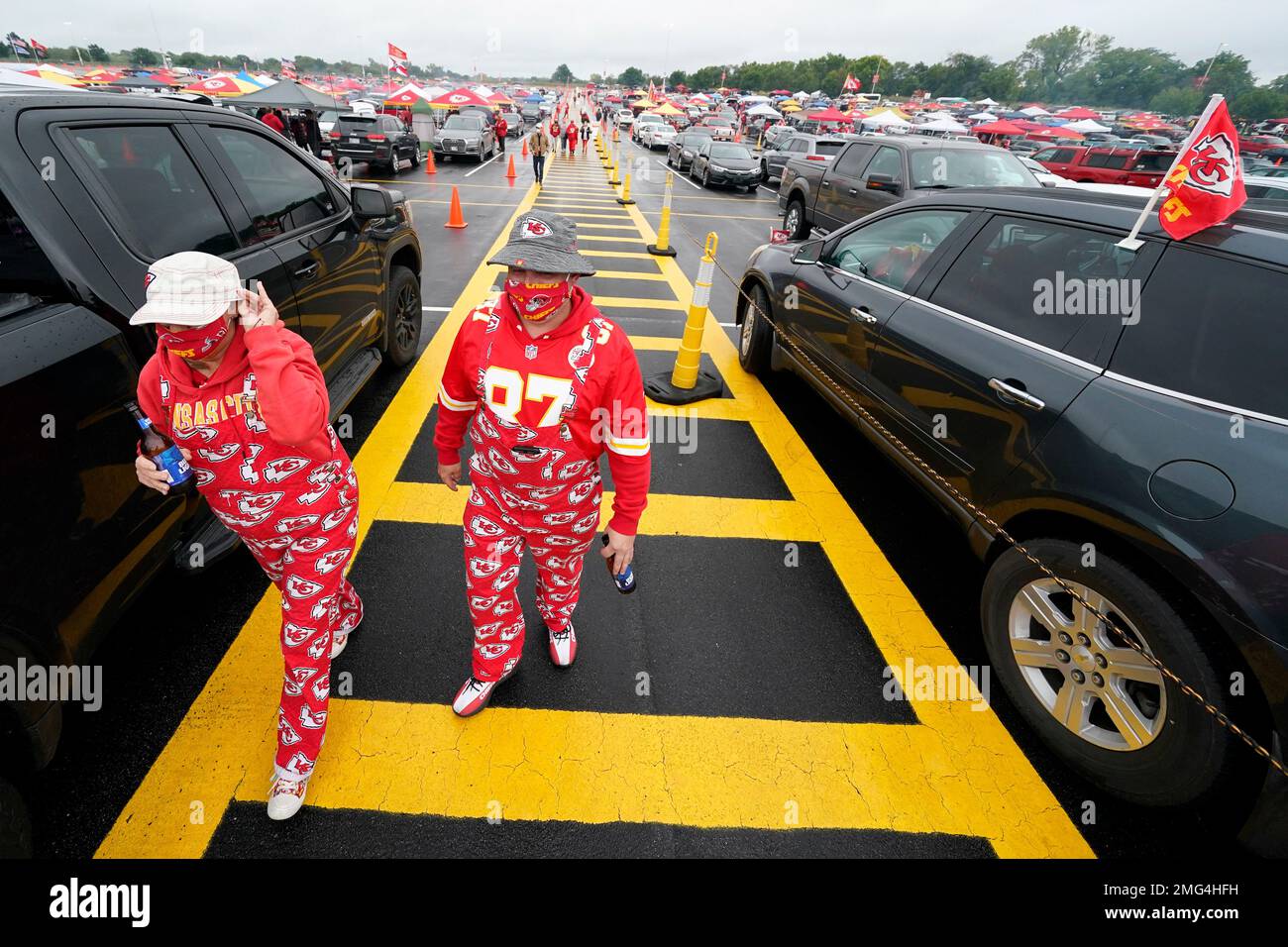 Fans arrive at Arrowhead Stadium before an NFL football game between ...