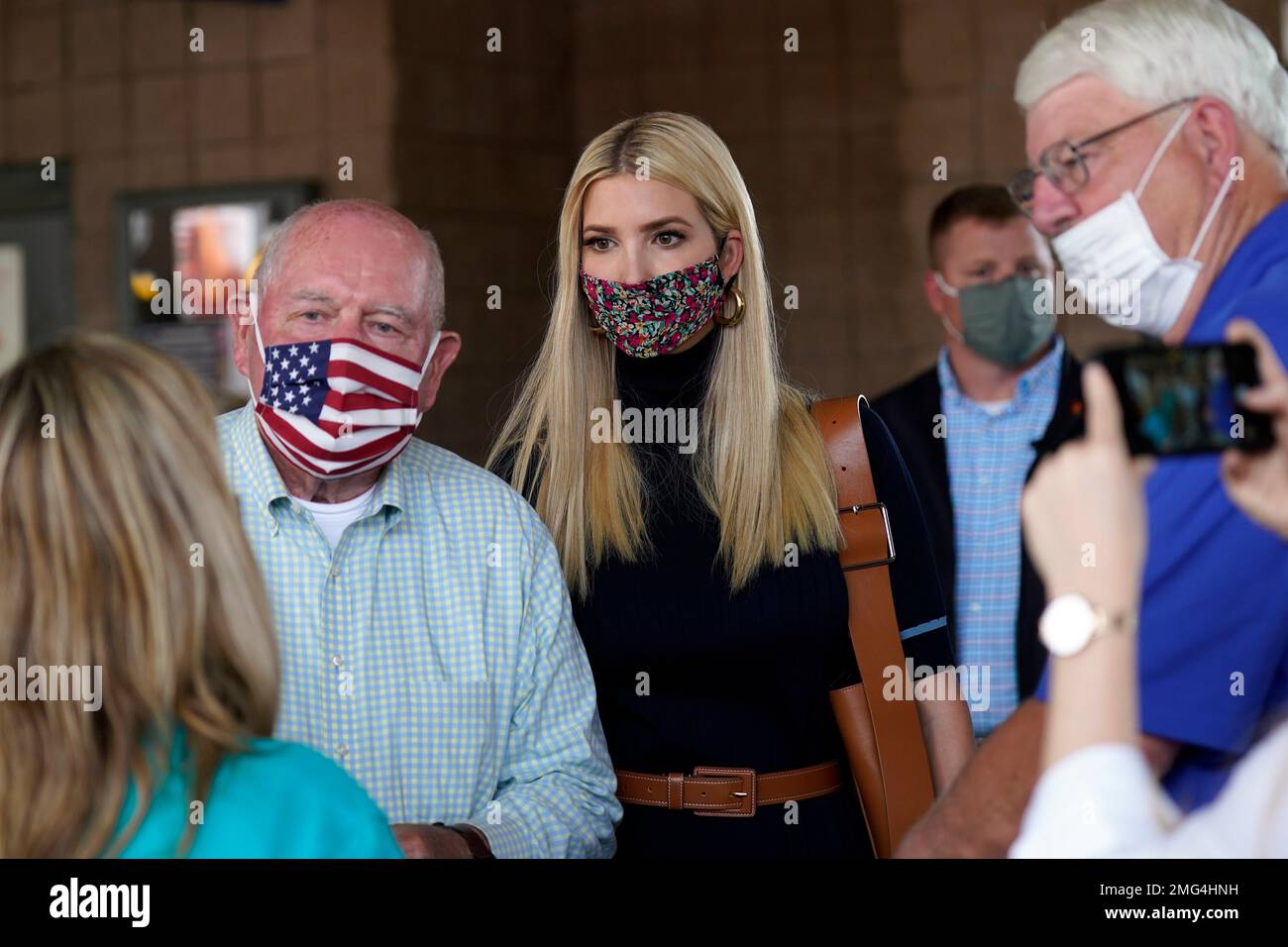 Ivanka Trump, center, and Secretary of Agriculture Sonny Perdue, left ...