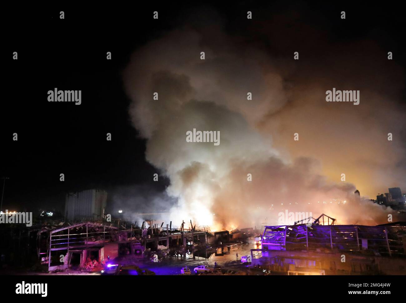 Flames and smoke rise from burning warehouses at the seaport of Beirut ...