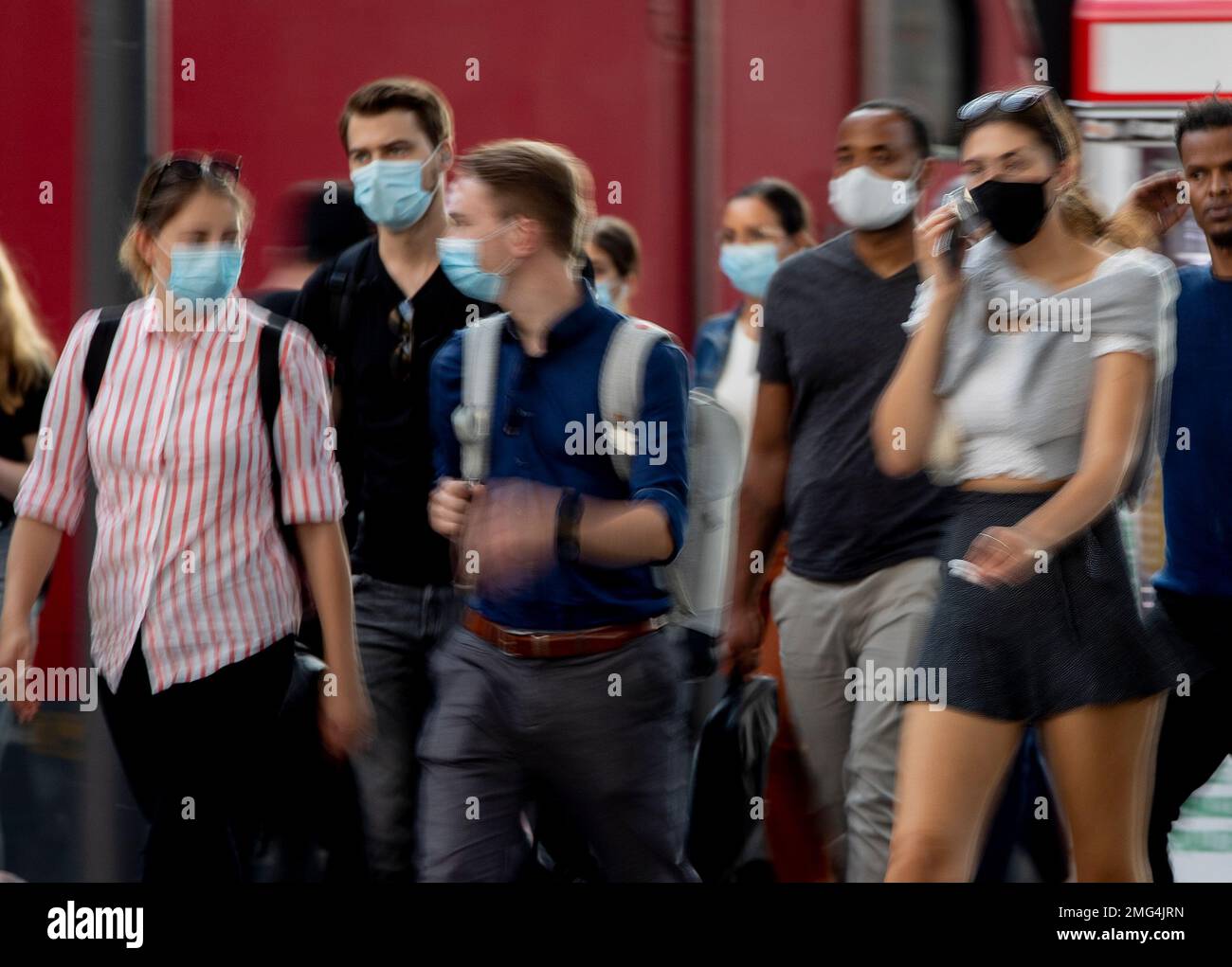 Passengers wear face masks in the main train station in Frankfurt ...