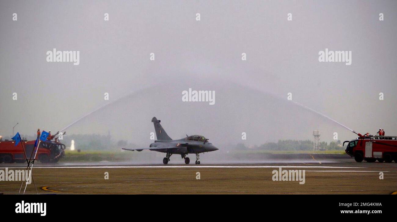 Water is sprayed on a French-made Rafale fighter jet during its ...