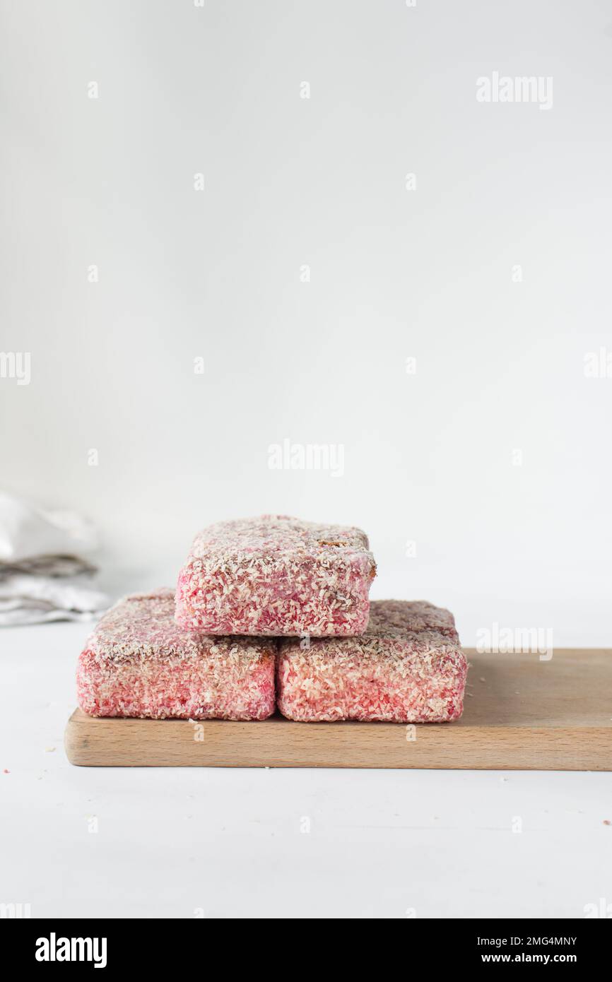 Pink lamingtons on a white background, Australian raspberry lamingtons ...
