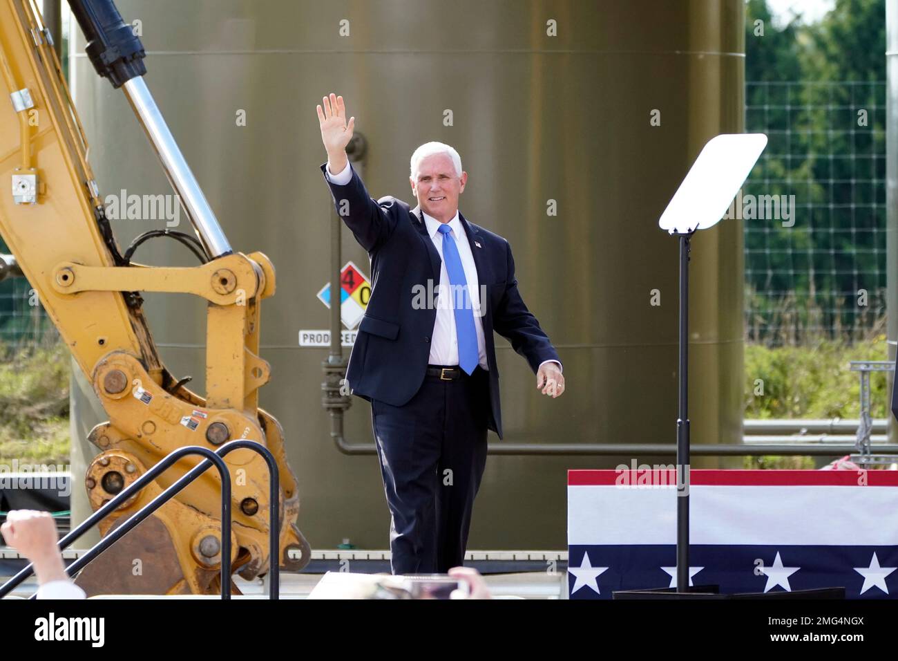 Vice President Mike Pence waves as he arrives to speak at a campaign ...