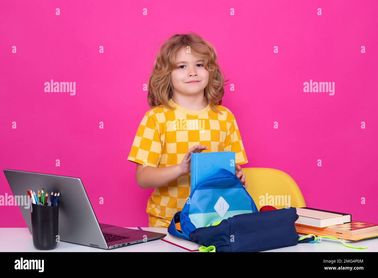 Little student school child isolated on studio background. Portrait of ...