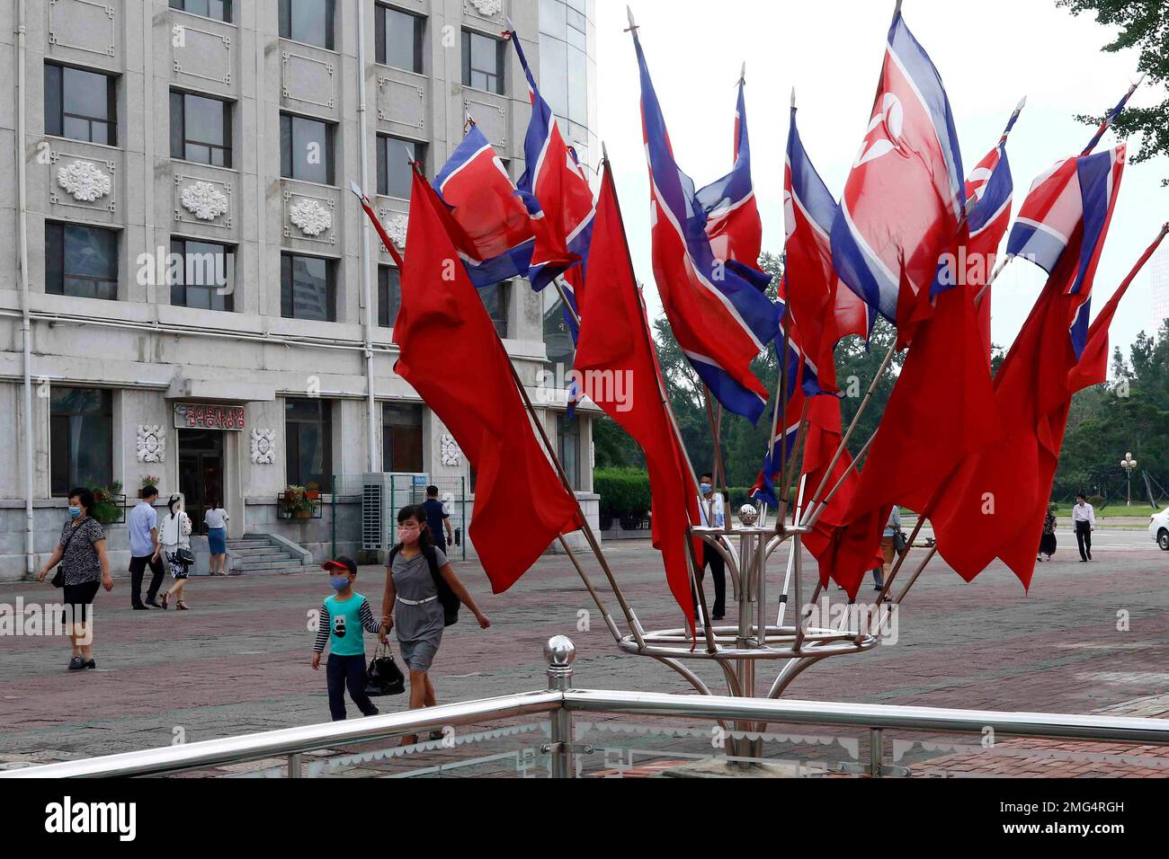North Korean national flags are displayed on a street on Wednesday ...