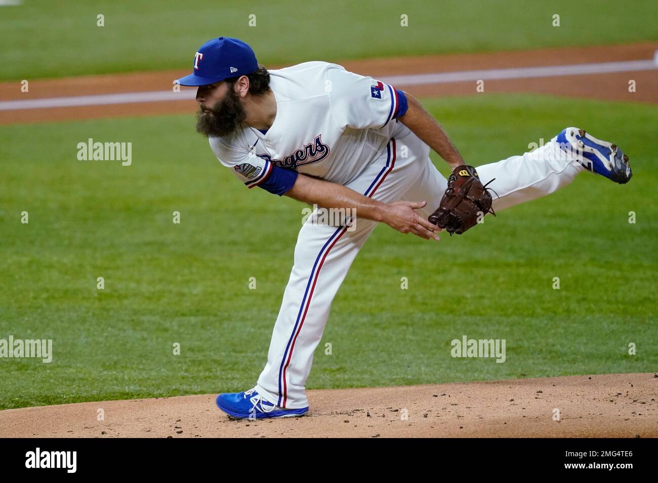 Texas Rangers starting pitcher Lance Lynn follows through on delivery ...