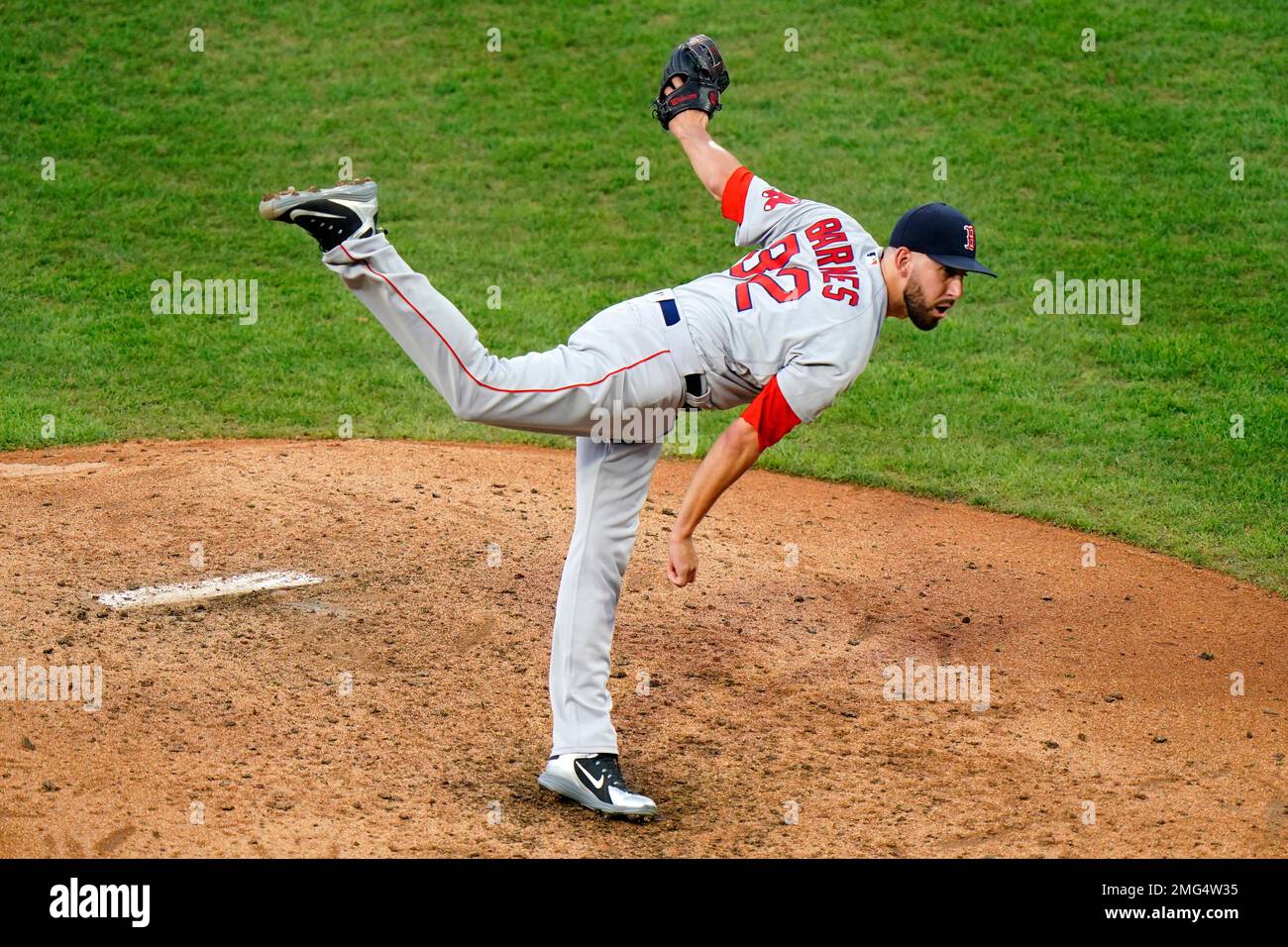 Boston Red Sox pitcher Matt Barnes follows through during the seventh ...