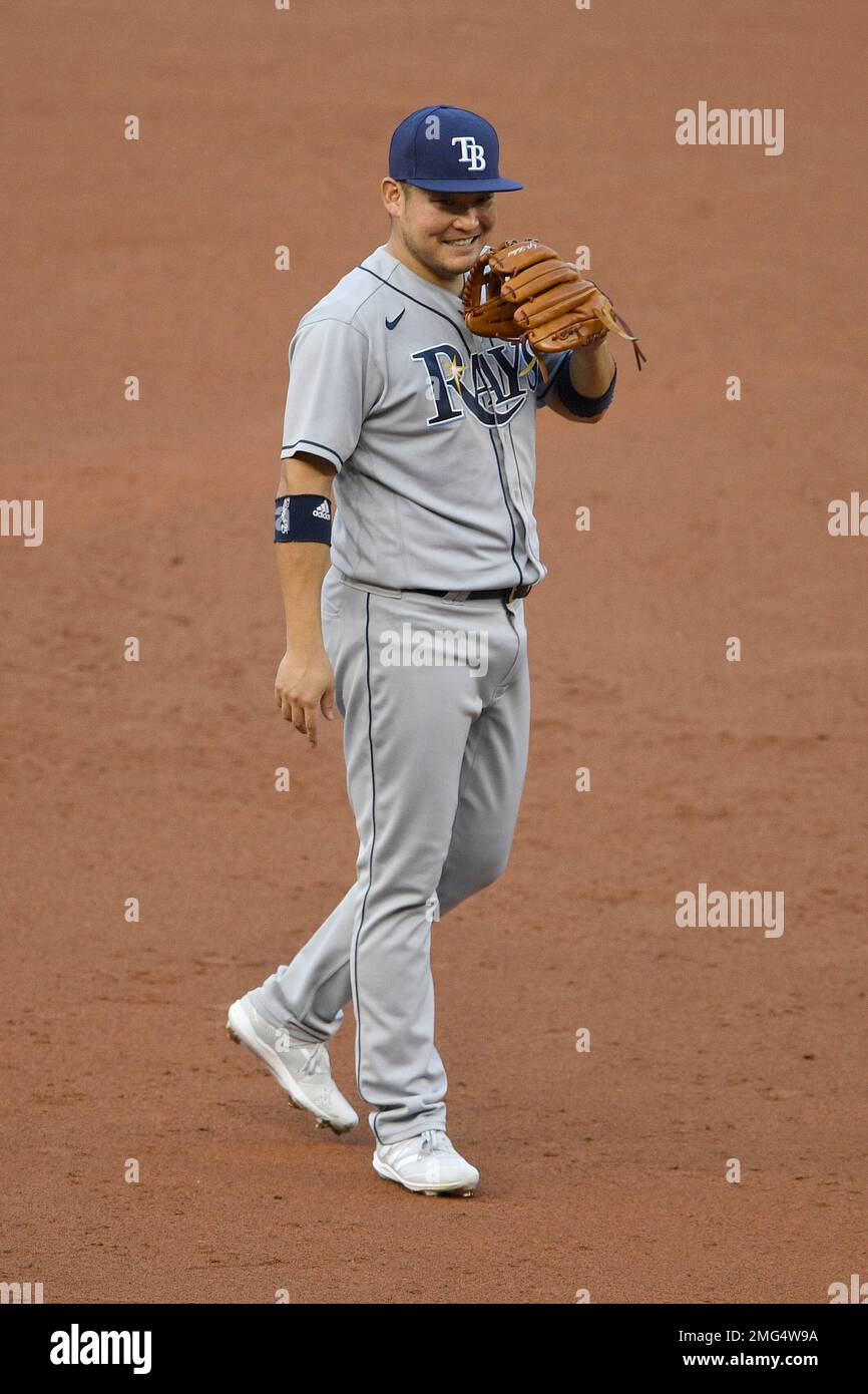 Tampa Bay Rays third baseman Yoshitomo Tsutsugo, of Japan, stands on ...