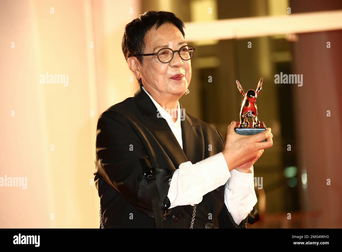 Director Ann Hui holds her Golden Lion award for Lifetime Achievement ...