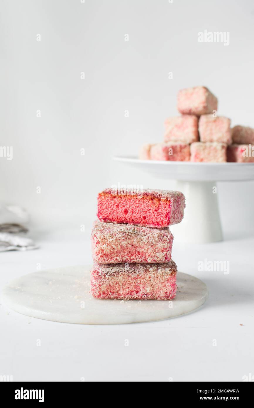 Pink lamingtons on a marble tray, Australian raspberry lamingtons, cake ...