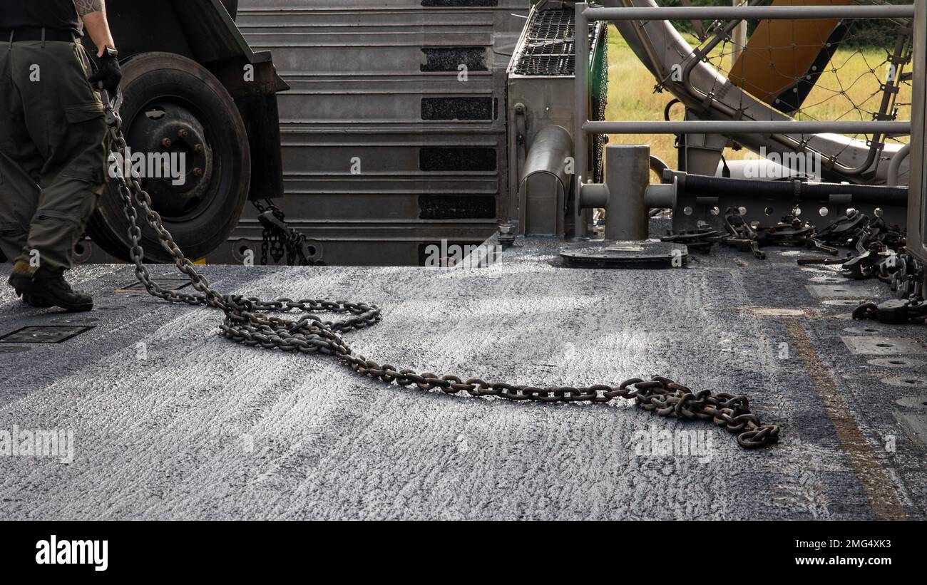 A U.S. Navy Sailor assigned to USS New Orleans (LPD 18), carries a ...