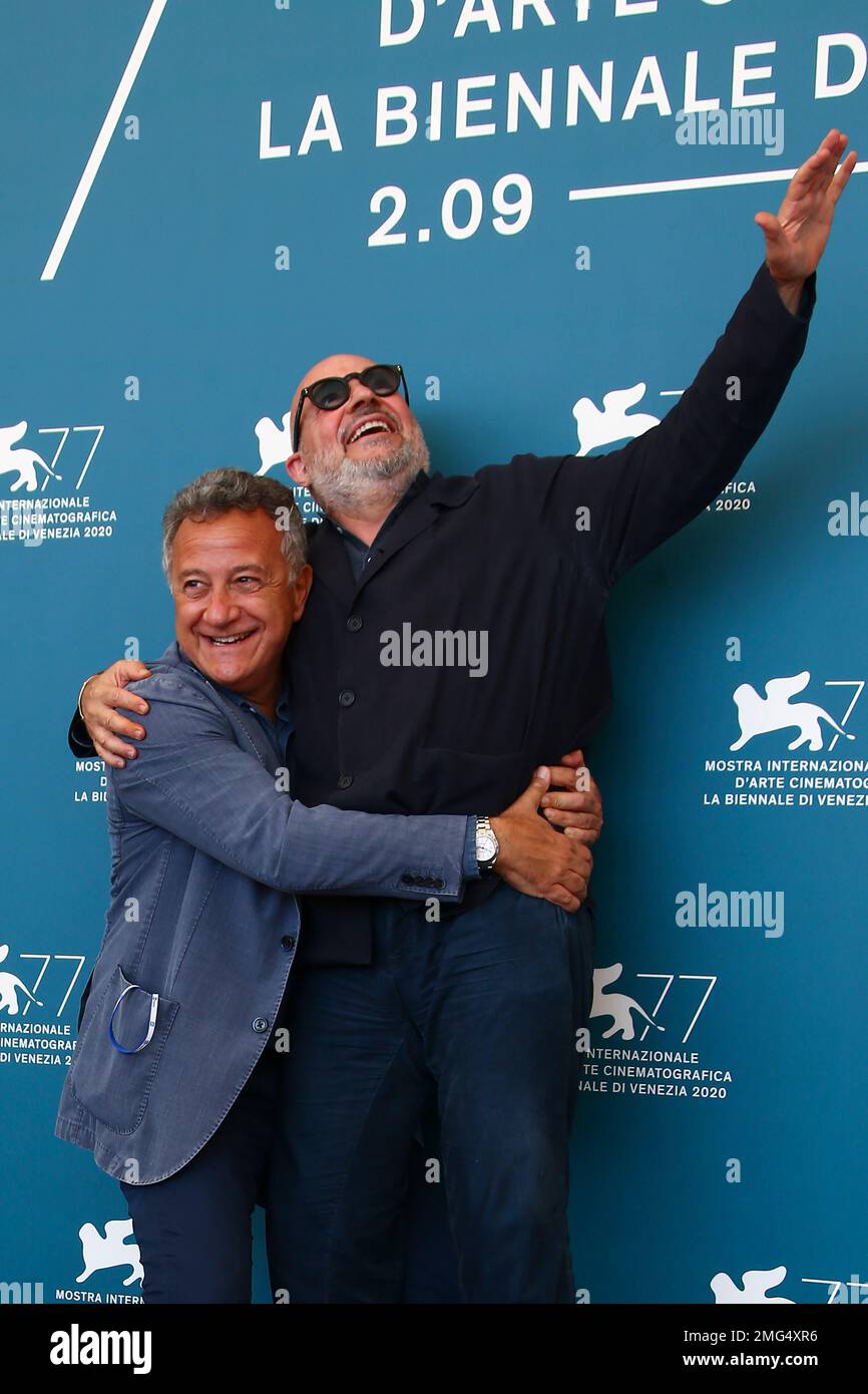 Director Gianfranco Rosi, right, and producer Paolo Del Brocco pose for ...
