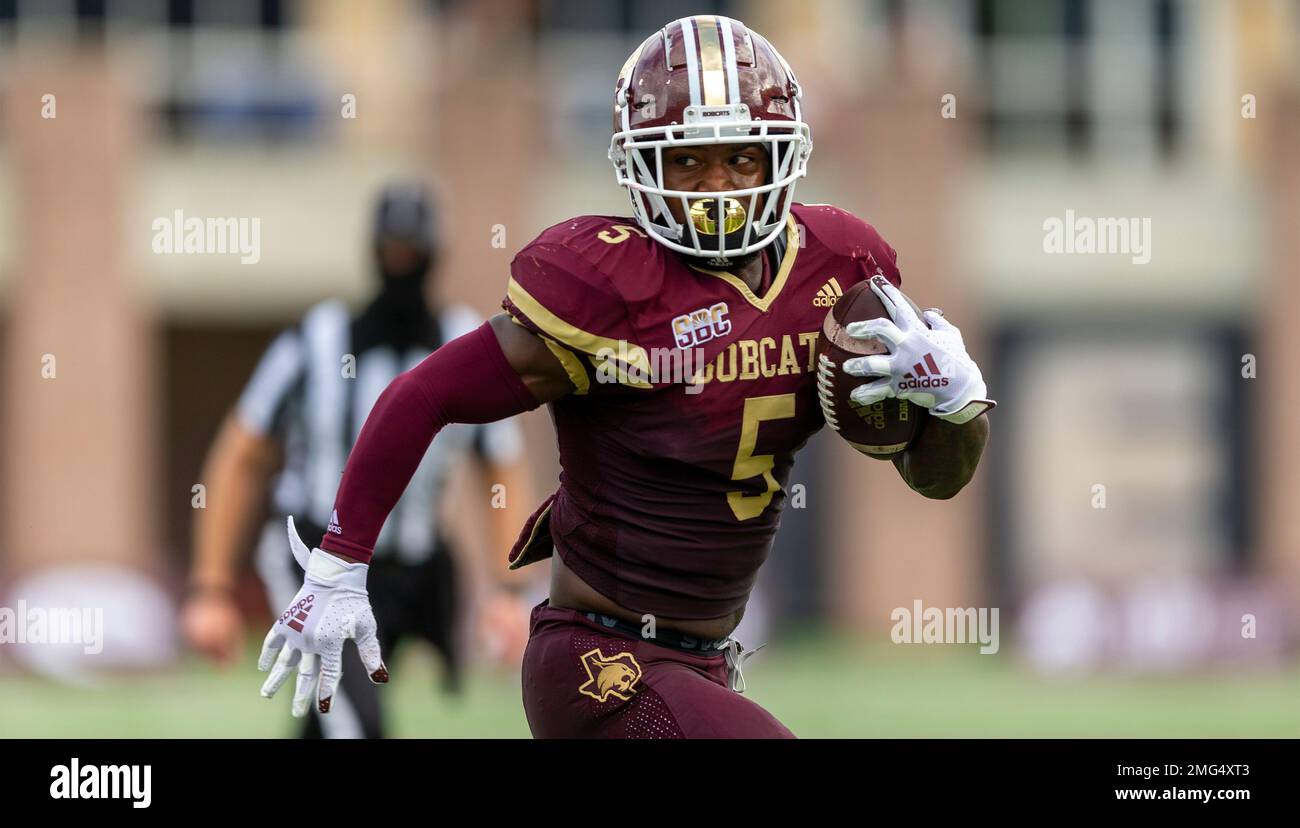 Texas State running back Brock Sturges (5) scrambles for more yards ...