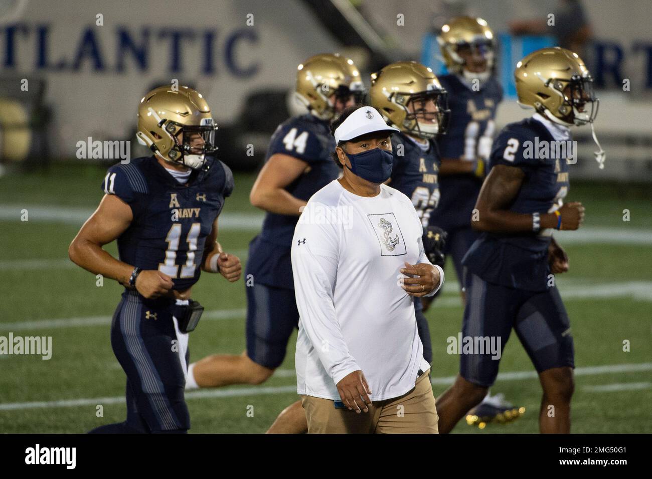Navy head coach Ken Niumatalolo walks with his team of the field before ...