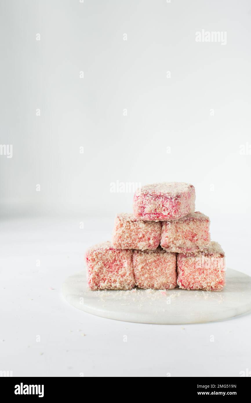 Pink lamingtons on a marble tray, Australian raspberry lamingtons, cake ...