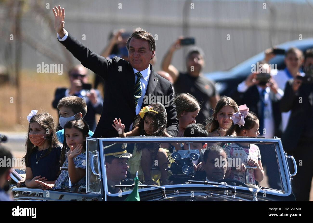 Brazil's President Jair Bolsonaro rides in an open car during an ...