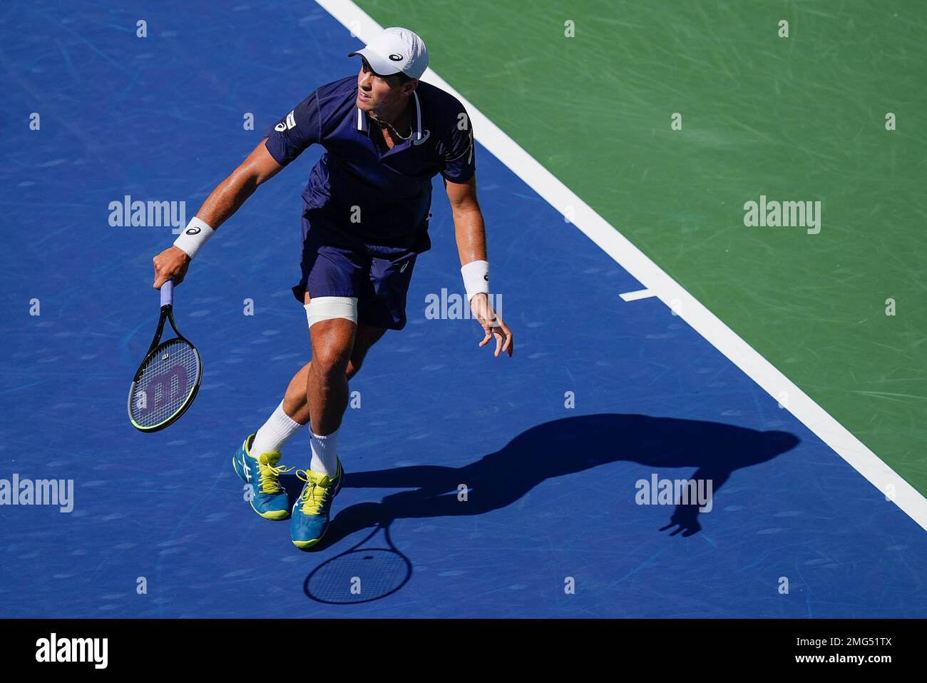 Vasek Pospisil, of Canada, returns a shot to Alex de Minaur, of ...
