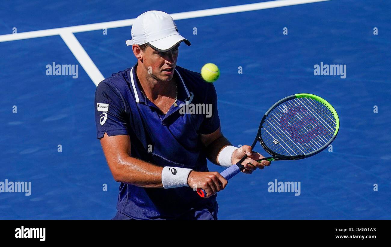 Vasek Pospisil, of Canada, returns a shot to Alex de Minaur, of ...
