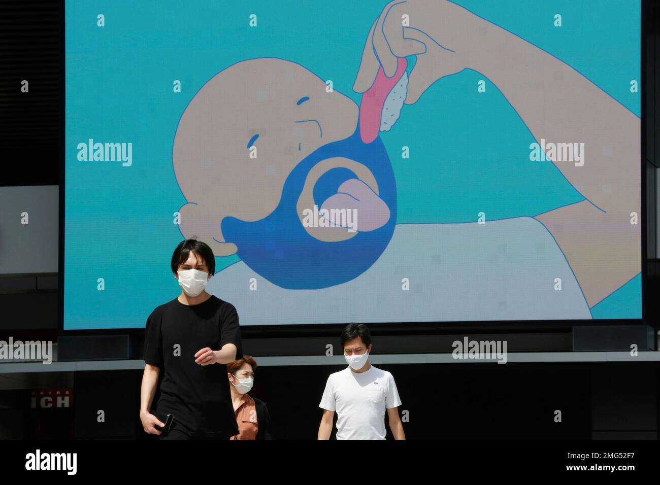 People wearing face masks to protect against the spread of the new ...