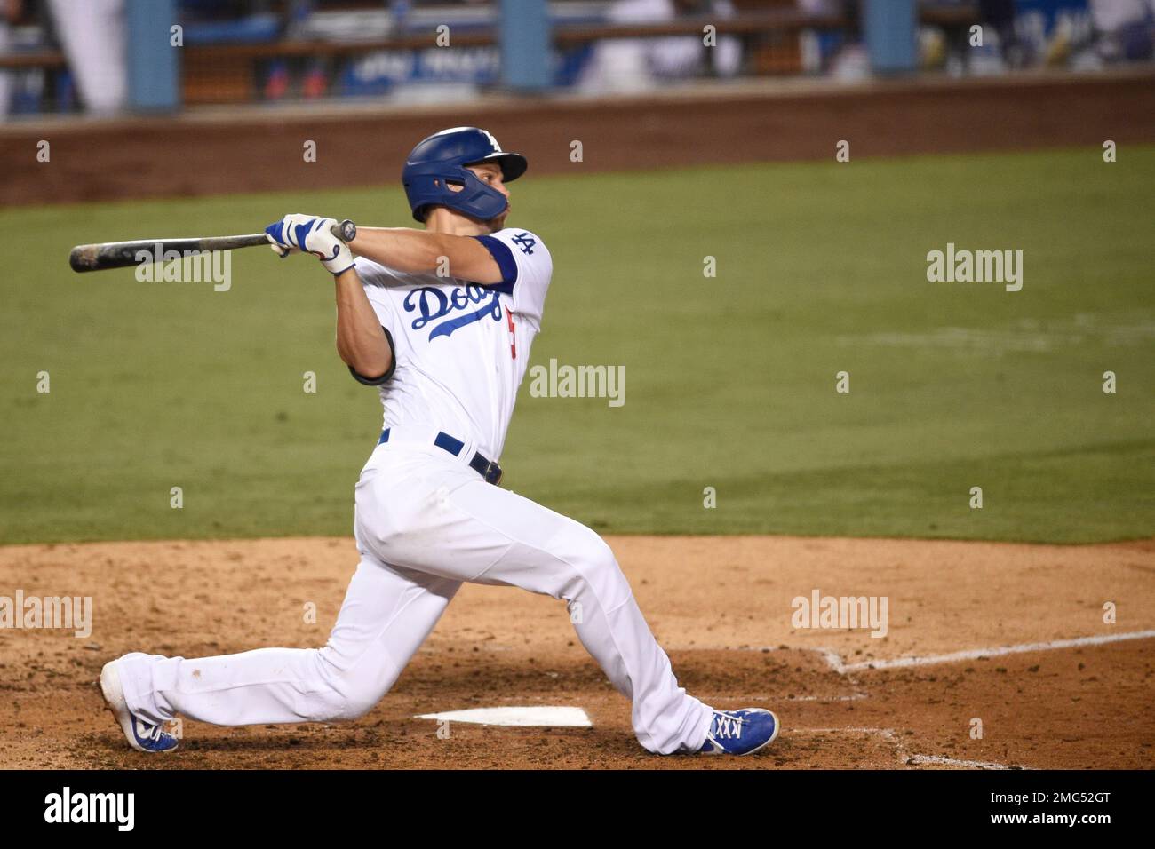 Los Angeles Dodgers' Corey Seager follows through on a swing for a two ...