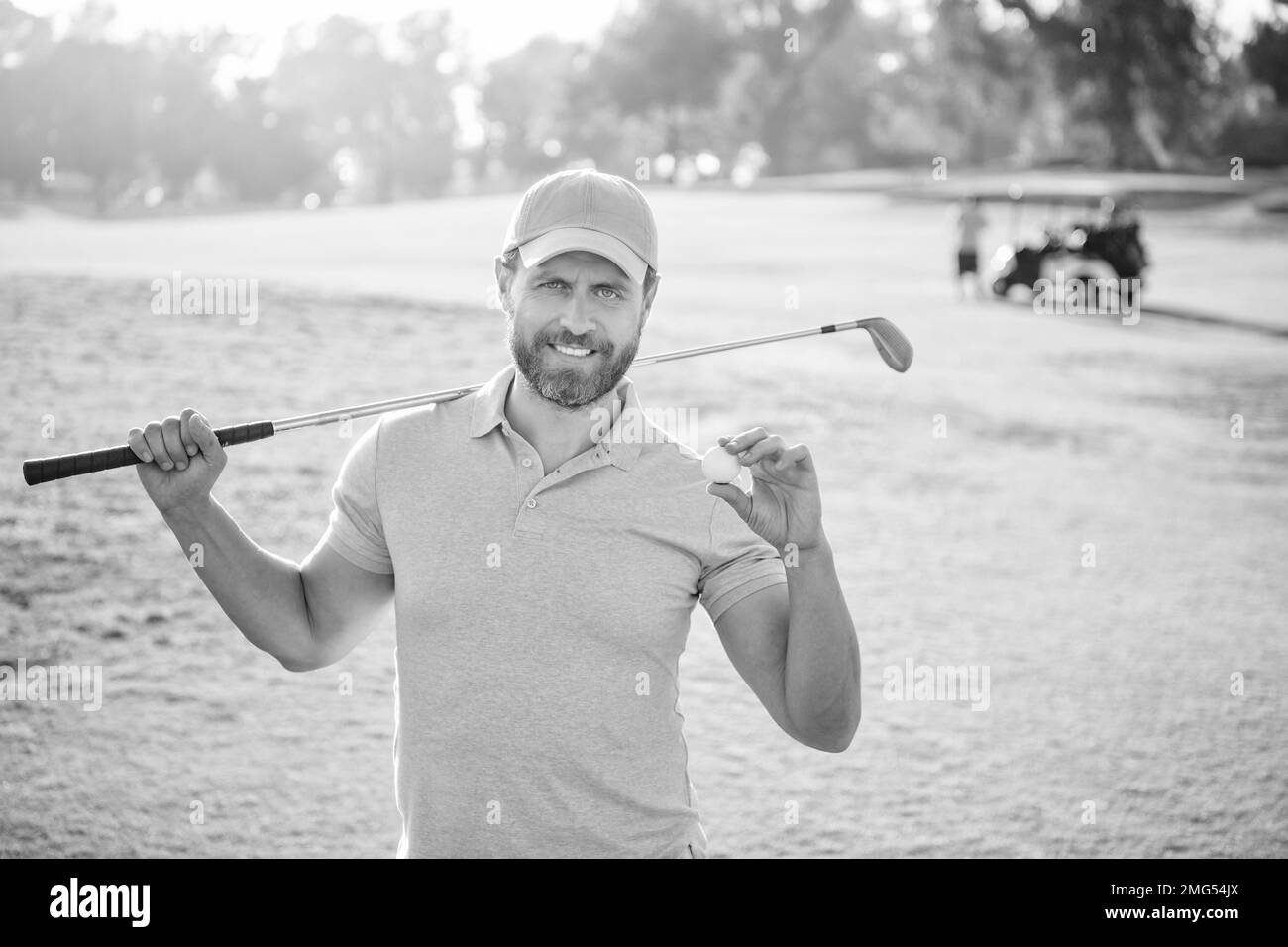 portrait of happy golfer in cap with golf club showing ball, golf Stock ...
