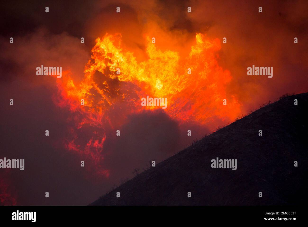 Flames from a brush fire flare in Yucaipa, Calif., Saturday, Sept. 5 ...