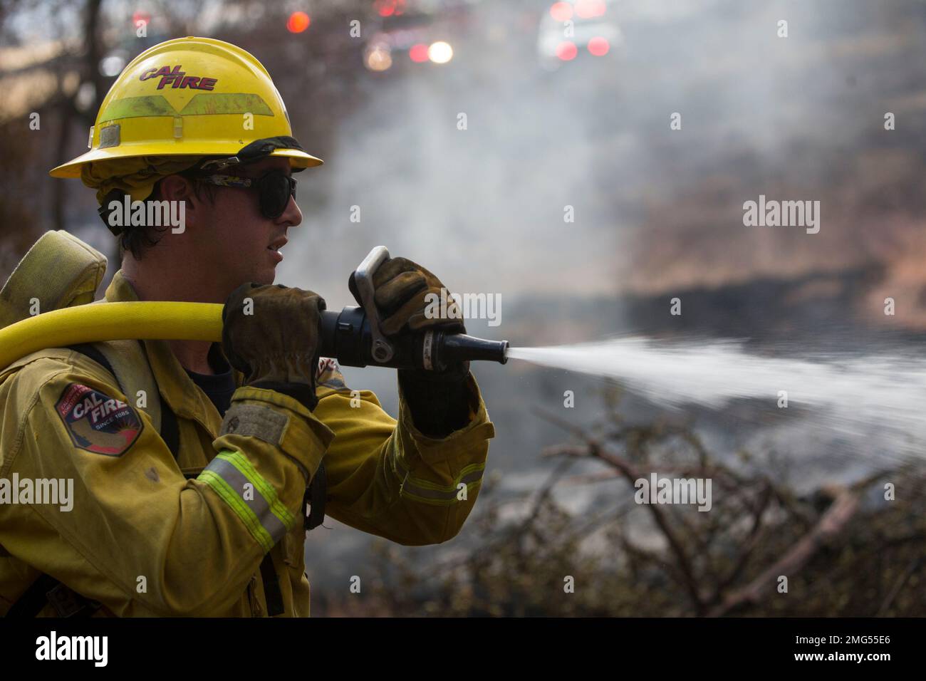 A firefighter battles a wildfire in Yucaipa, Calif., Saturday, Sept. 5 ...