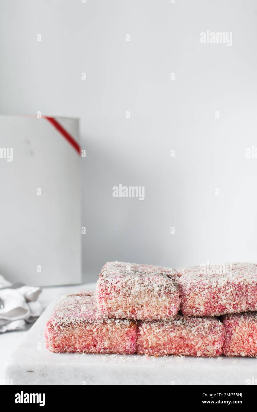 Pink lamingtons on a marble tray, Australian raspberry lamingtons, cake ...