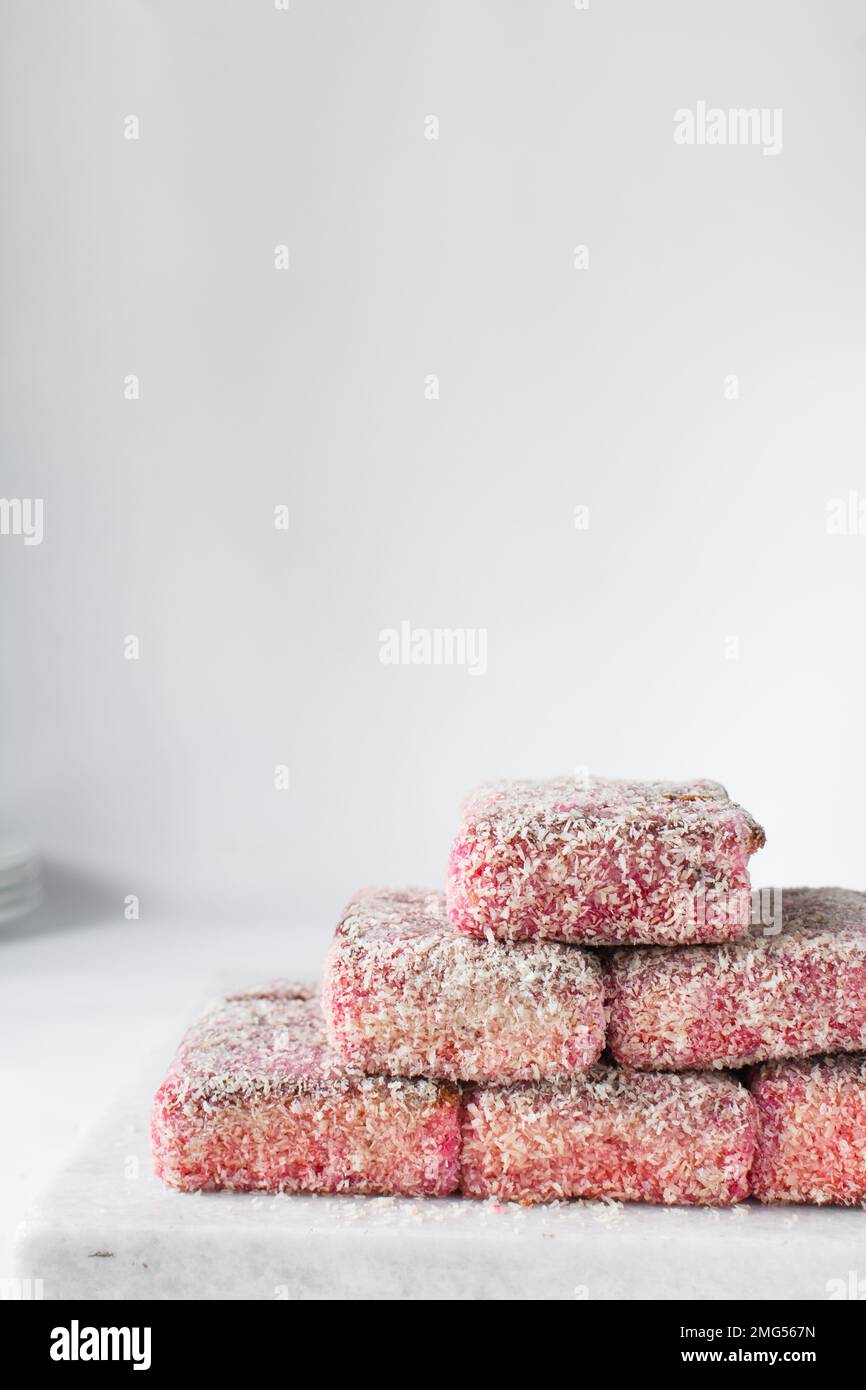 Pink lamingtons on a marble tray, Australian raspberry lamingtons, cake ...