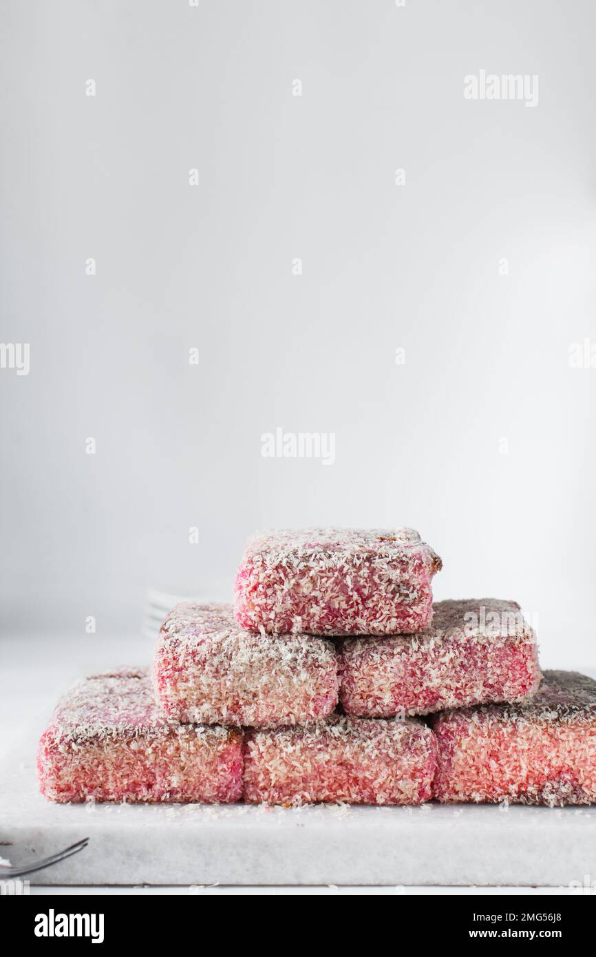Pink lamingtons on a marble tray, Australian raspberry lamingtons, cake ...