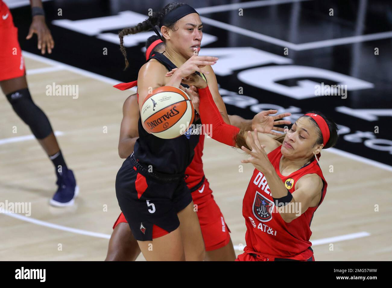 Atlanta Dream's Chennedy Carter, right, knocks the ball away from Las ...