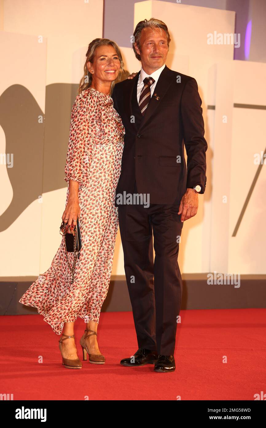 Actor Mads Mikkelsen, right, and Hanne Jacobsen pose for photographers ...