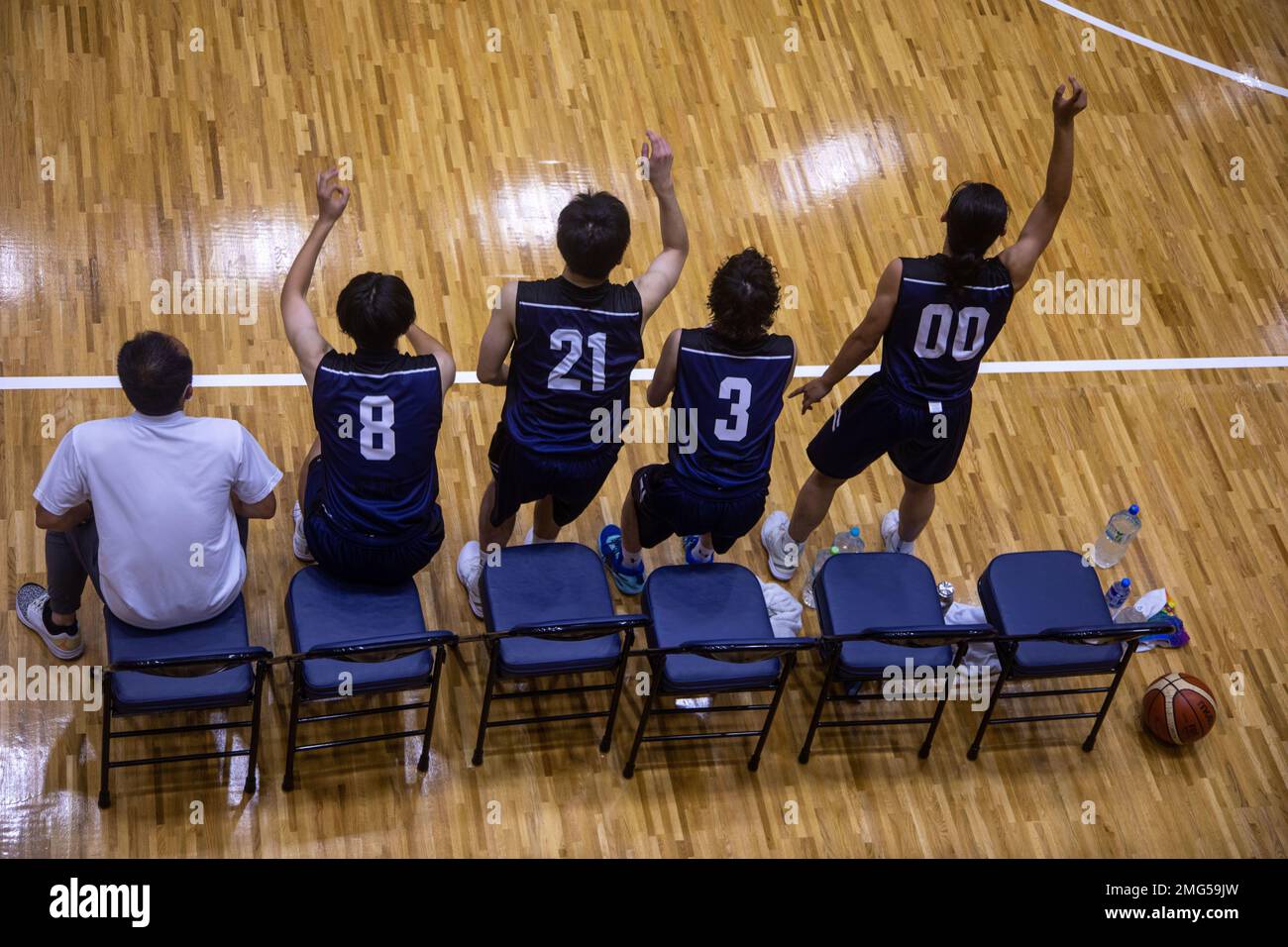 Members of the Rising Warriors basketball team cheer during a U.S ...