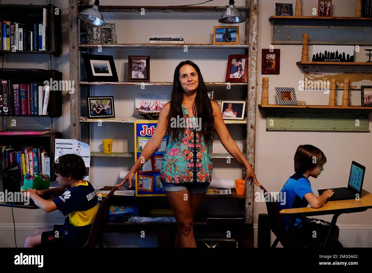 Anna Hamilton, 43, center, poses for a photograph with her sons, Henry ...