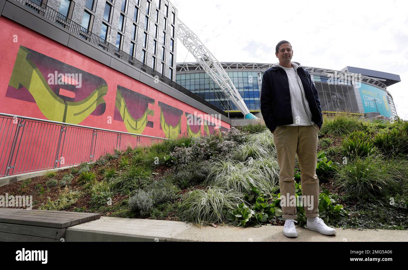 Graffiti Artist Pref poses with his artwork called 'Better Together ...