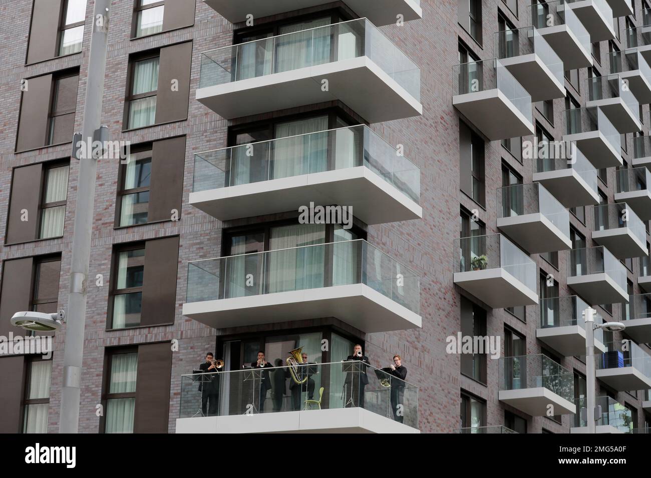 Musicians with the Royal Philharmonic Orchestra play on a balcony at ...