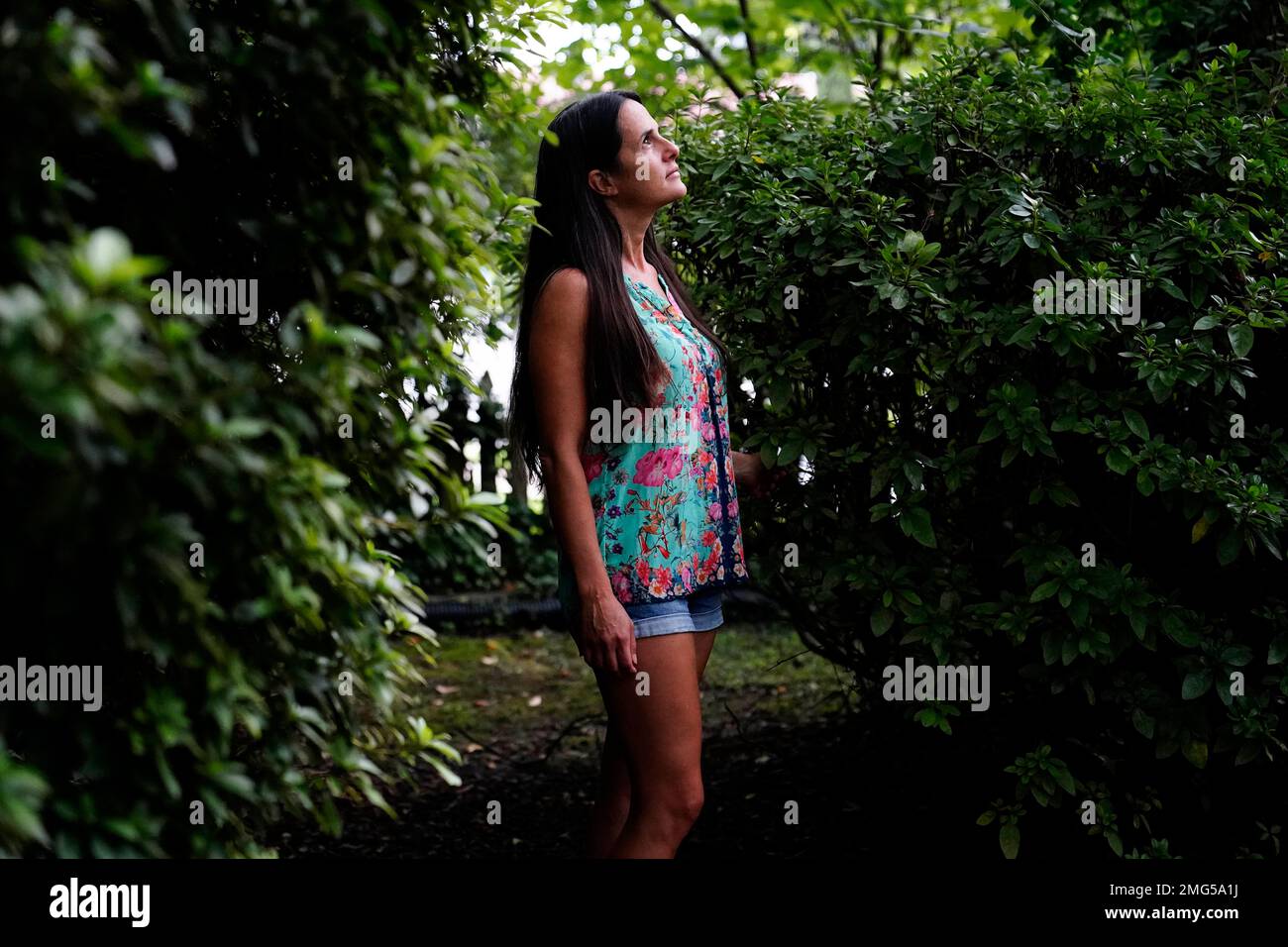 Anna Hamilton, 43, center, poses for a photograph on Monday, Aug. 24 ...