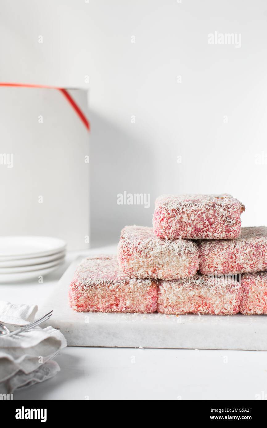 Pink lamingtons on a marble tray, Australian raspberry lamingtons, cake ...