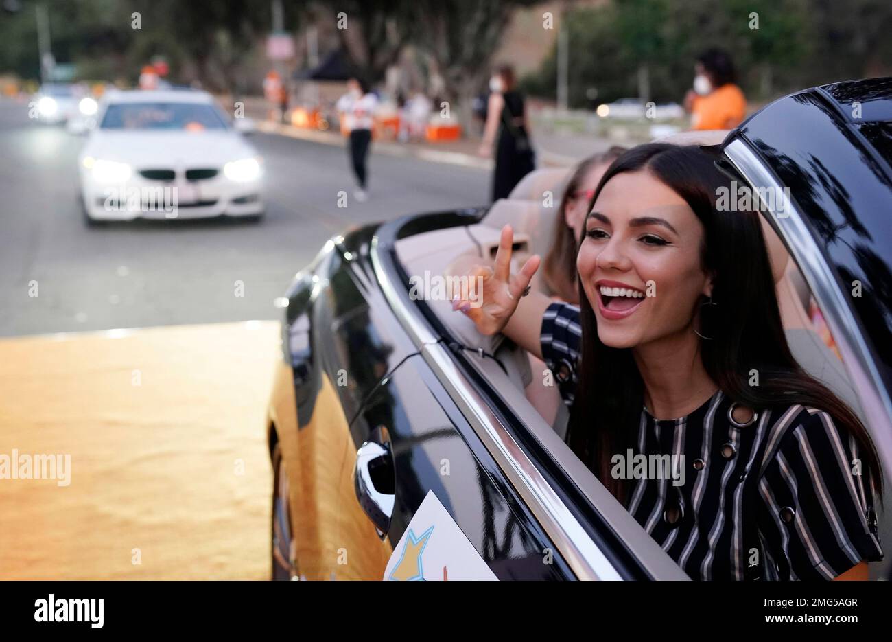Actress Victoria Justice poses from a car as she arrives at the Drive ...