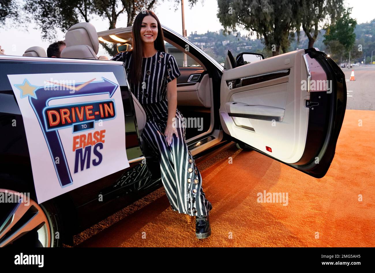 Actress Victoria Justice poses from a car as she arrives at the Drive ...