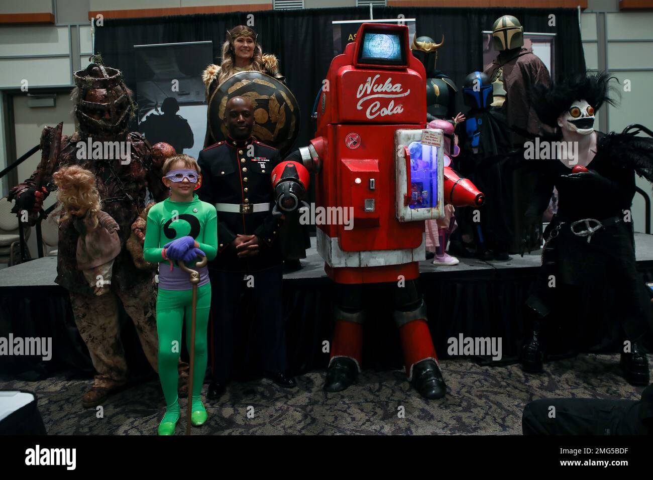 U.S. Marine Corps Sgt. Deangelo Wiley poses with the Cosplay Contest ...