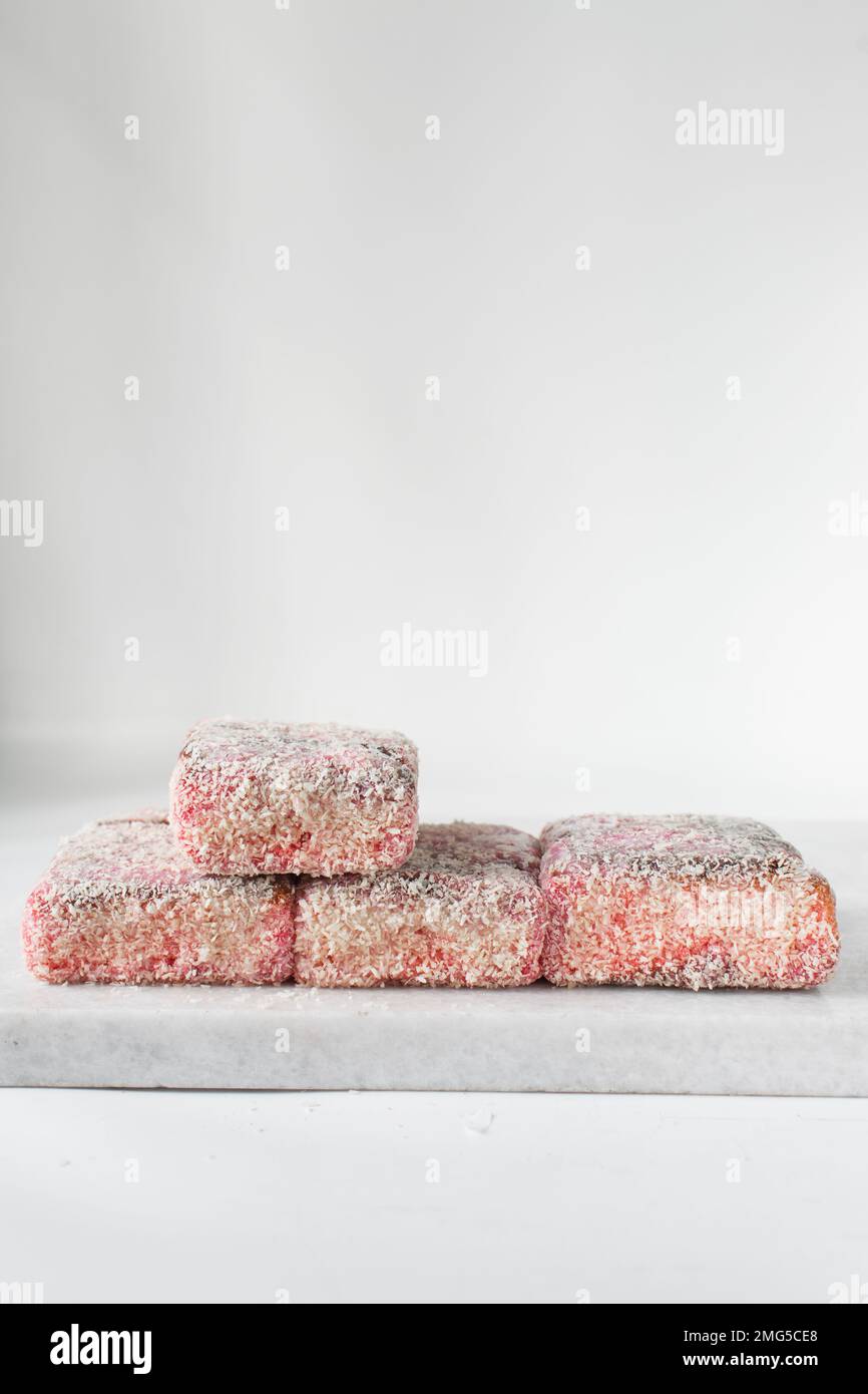 Pink lamingtons on a marble tray, Australian raspberry lamingtons, cake ...