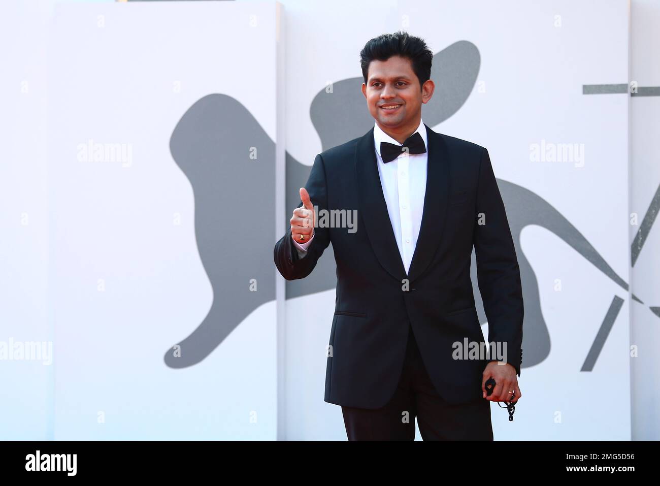Actor Aditya Modak poses for photographers upon arrival at the premiere ...