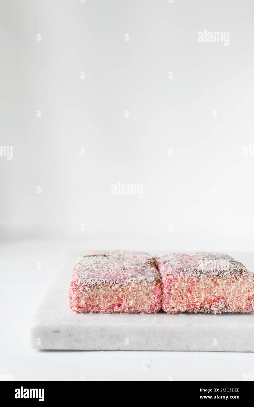Pink lamingtons on a marble tray, Australian raspberry lamingtons, cake ...