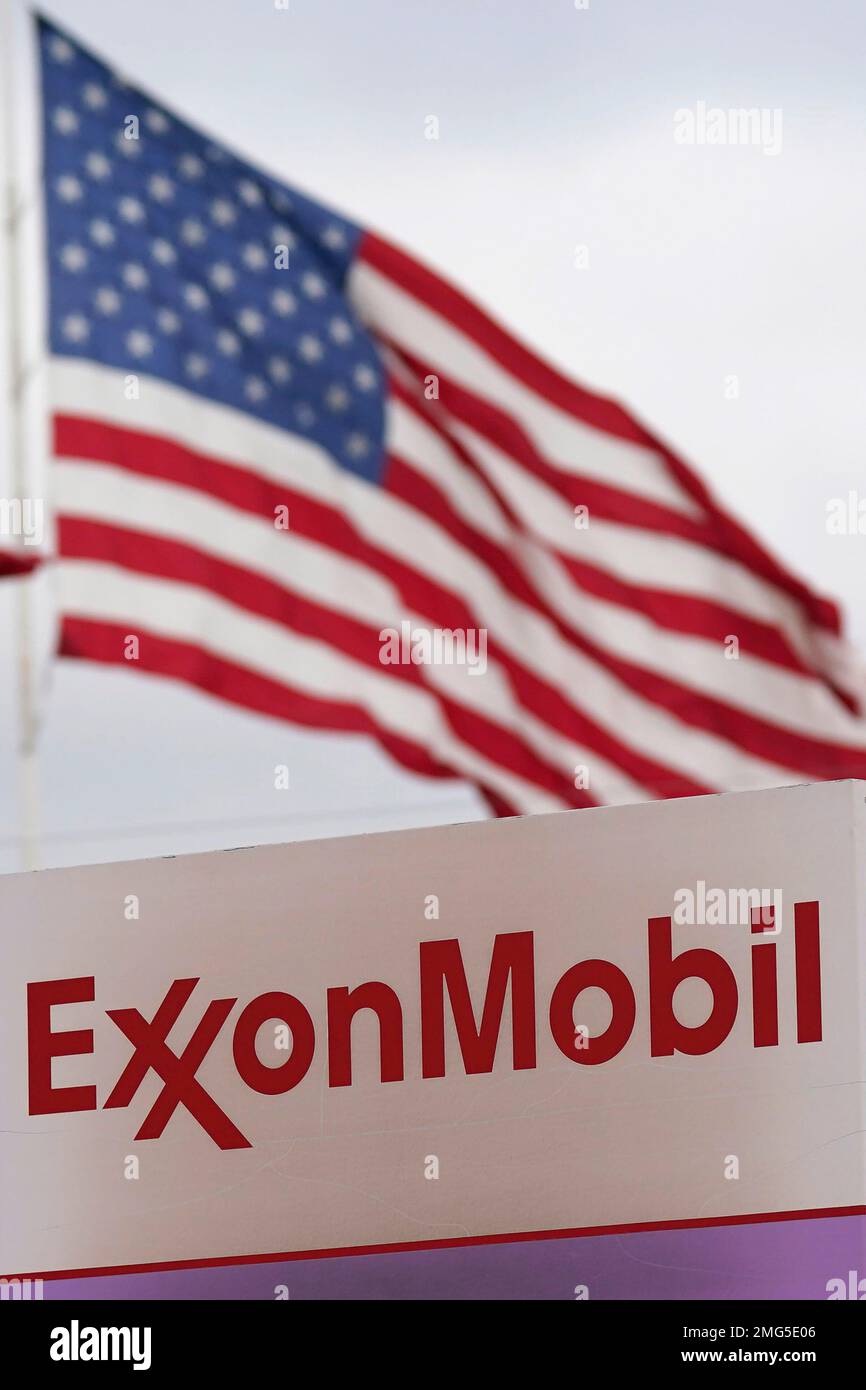 A U.S. flag flies near an ExxonMobil fuel storage and distribution ...